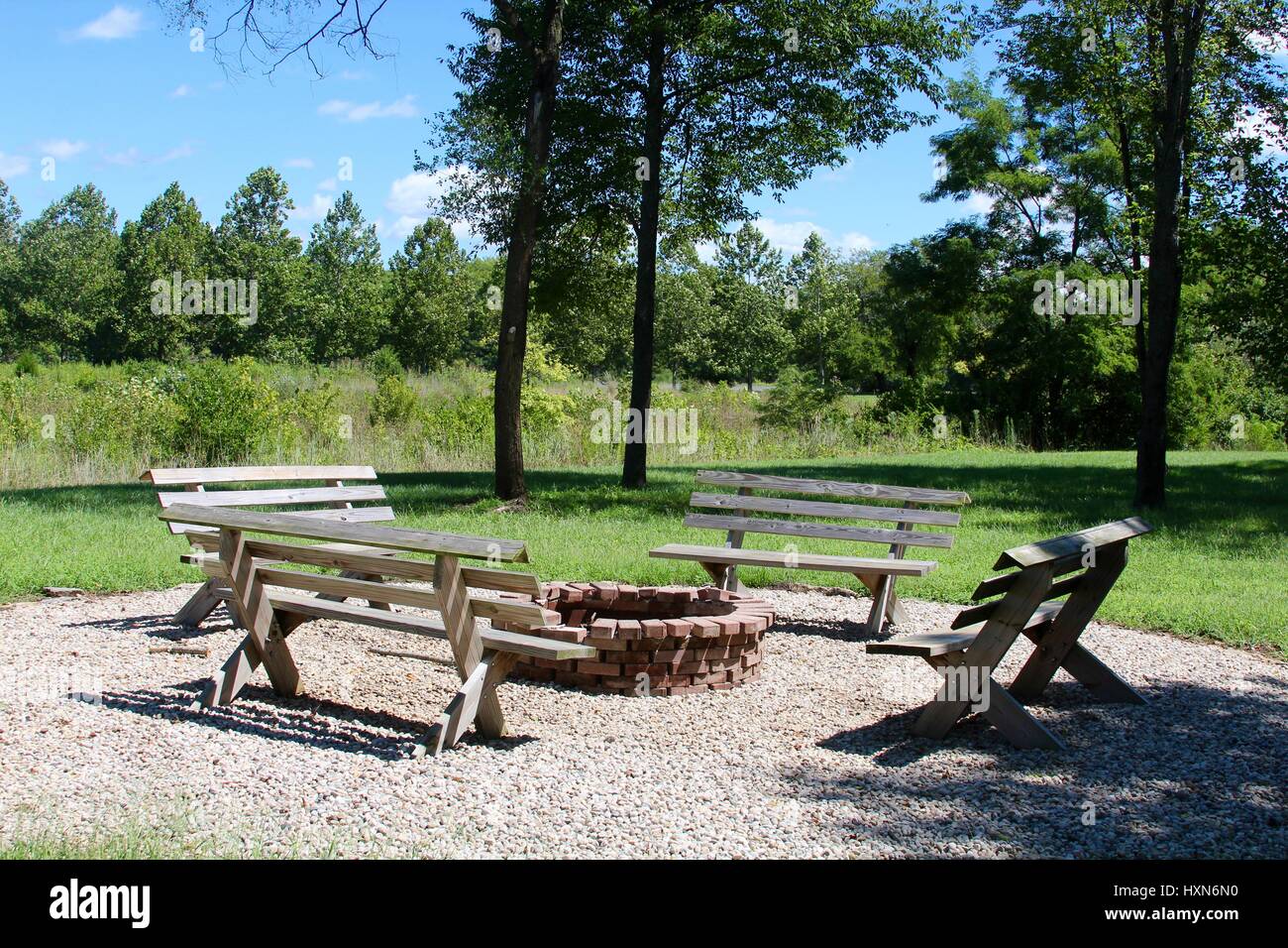 the park benches around the fire pit Stock Photo - Alamy