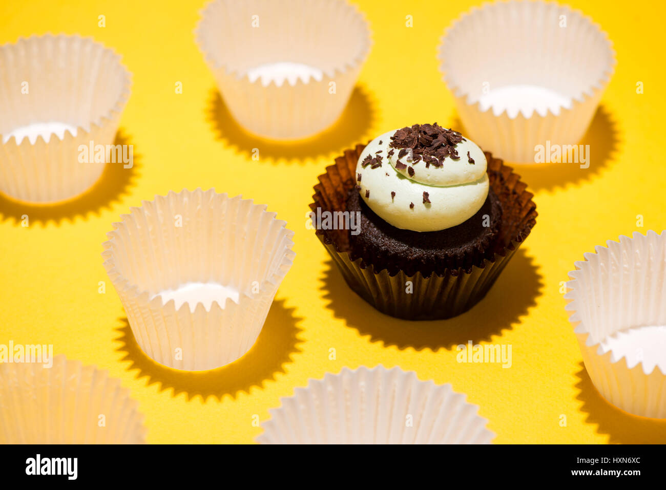 Birthday cupcake against a yellow background Stock Photo - Alamy