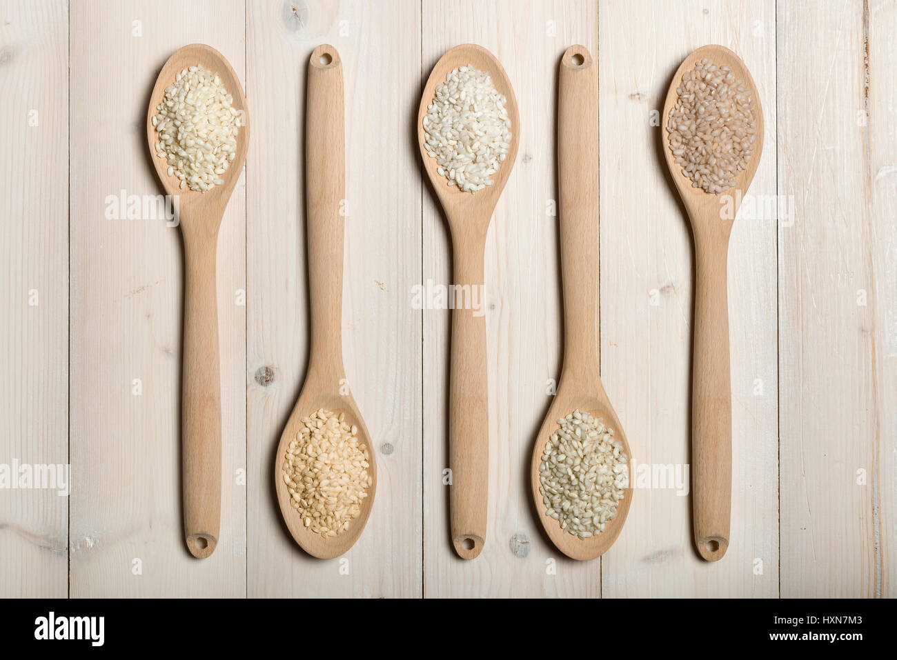 variety of different rice in wooden spoons Stock Photo - Alamy
