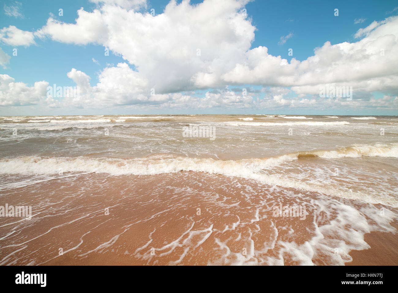 Waves on sand at Baltic sea coast Stock Photo - Alamy