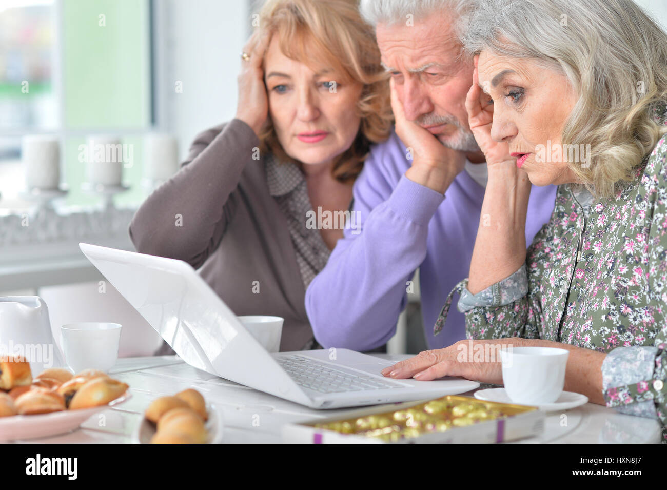 Elderly people using a laptop Stock Photo - Alamy