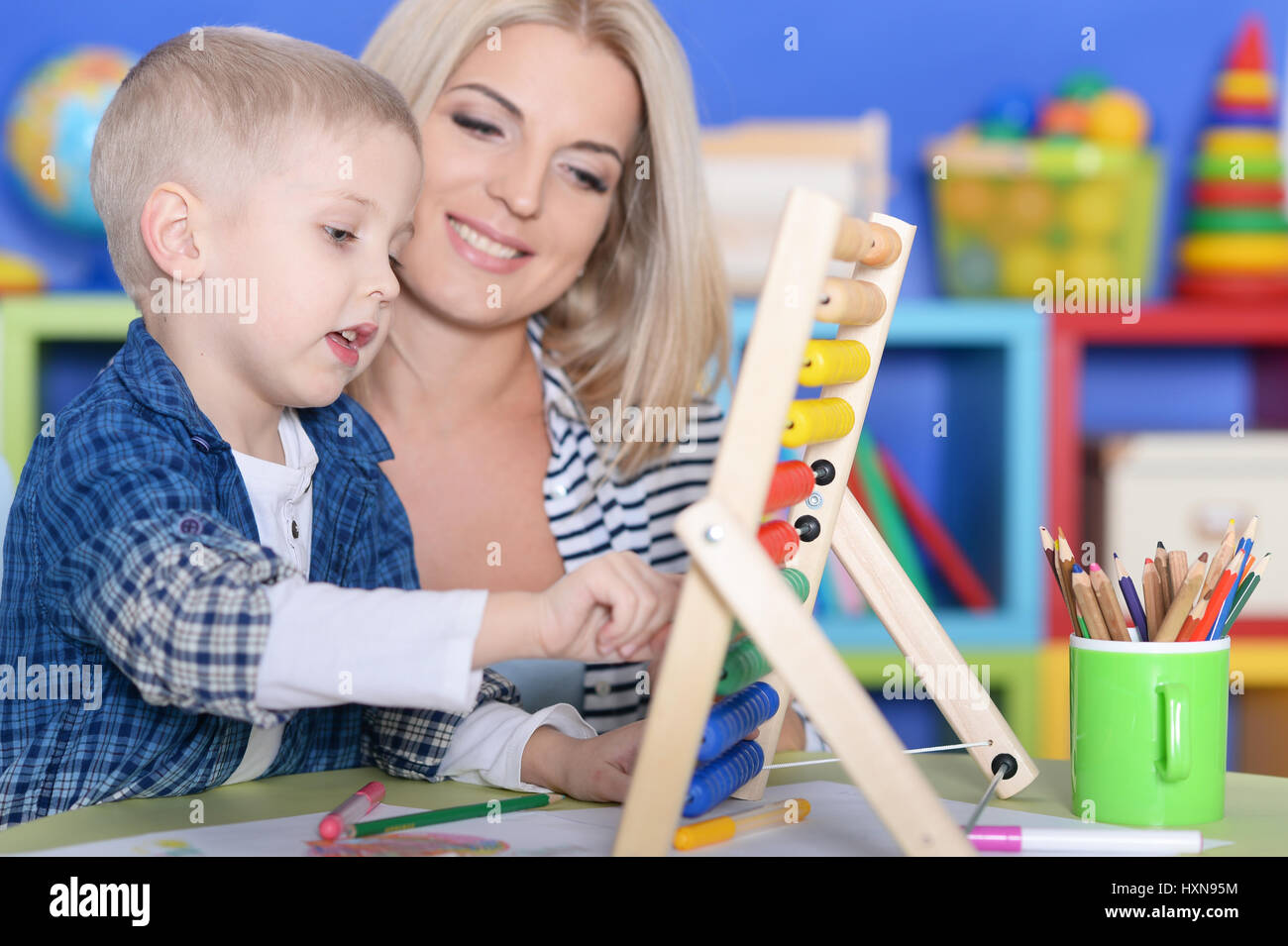 Mother teaches son to count Stock Photo - Alamy