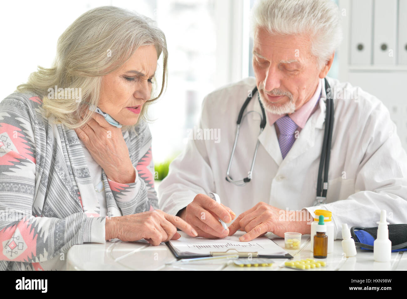 Sick elderly woman in a doctor's office Stock Photo - Alamy