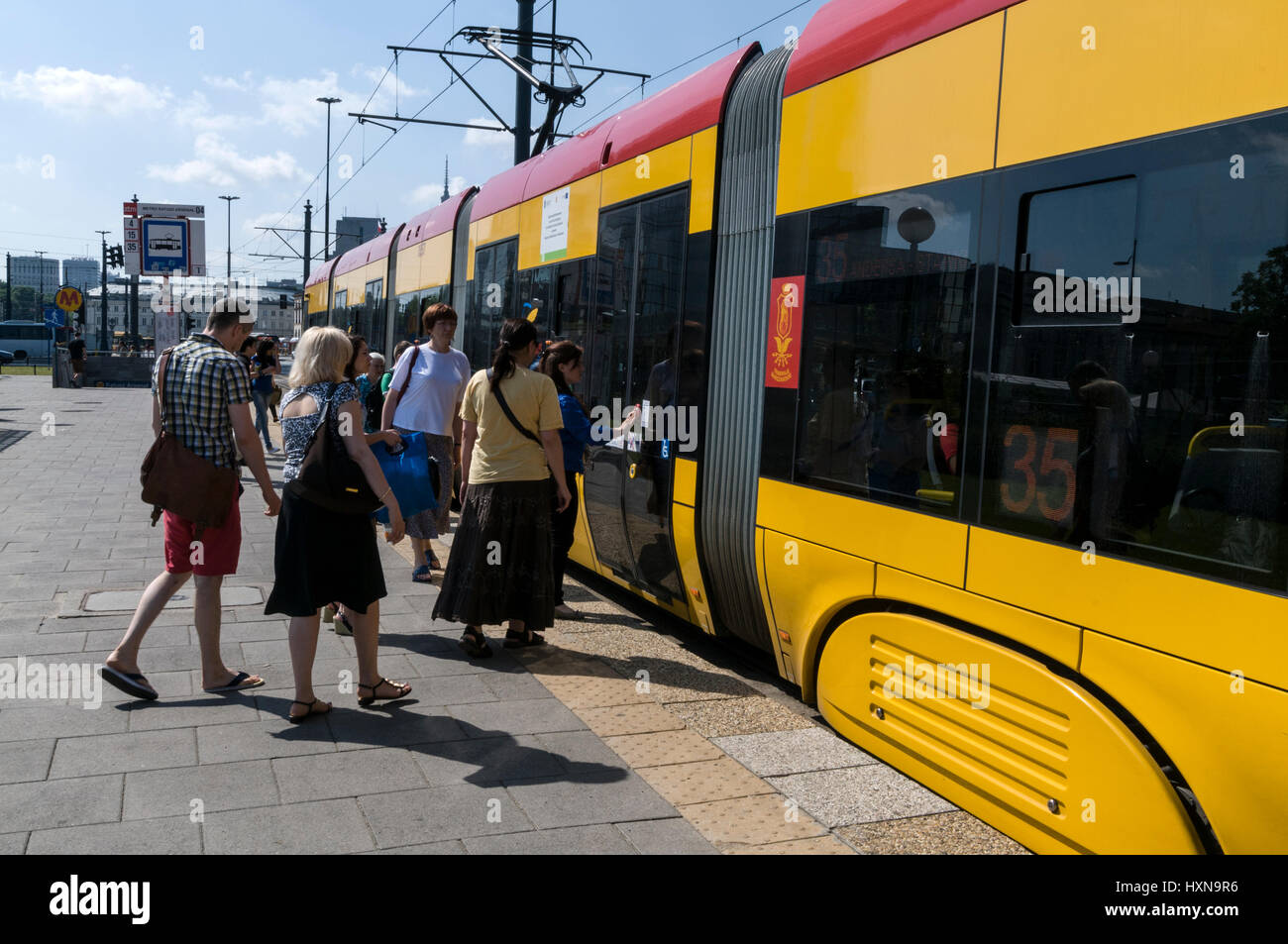 A busy tram terminal on Al Jerozolimskie in Warsaw, Poland Stock Photo ...