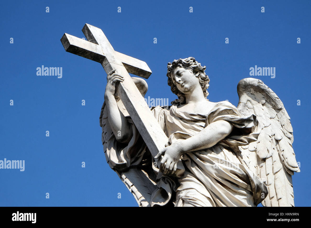 Statue of angel with the cross hi-res stock photography and images - Alamy