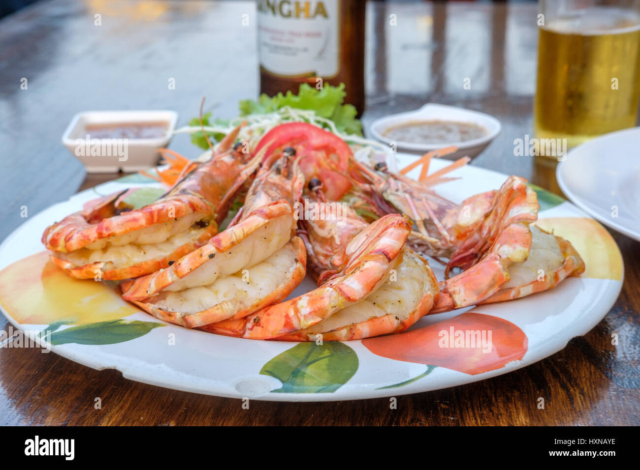 Tiger prawn barbeque served at a Thai restaurant at the night market in ...