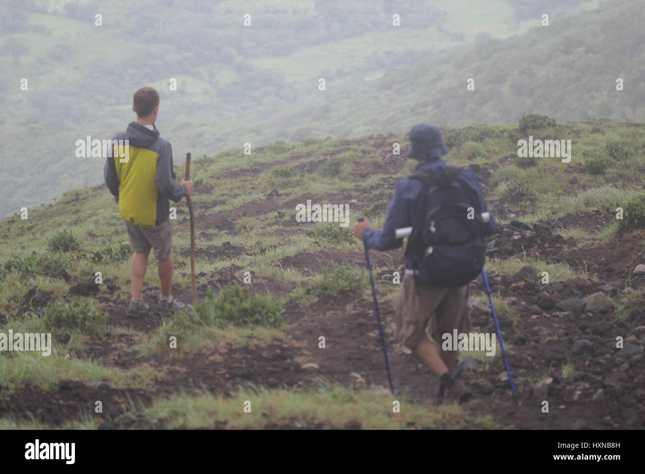 Person on a difficult and exhausting Hike to very high mountain Stock ...