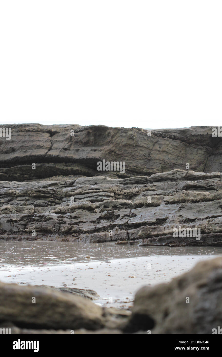 Rock with natural pattern at the beach Stock Photo - Alamy