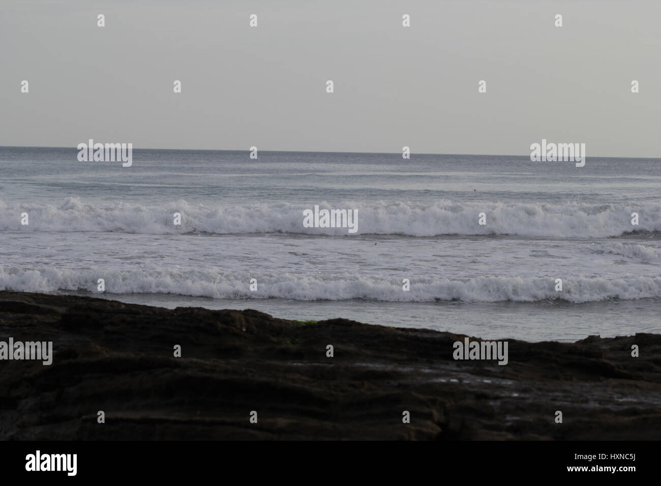 Empty beach at the sunset next to ocean Stock Photo - Alamy