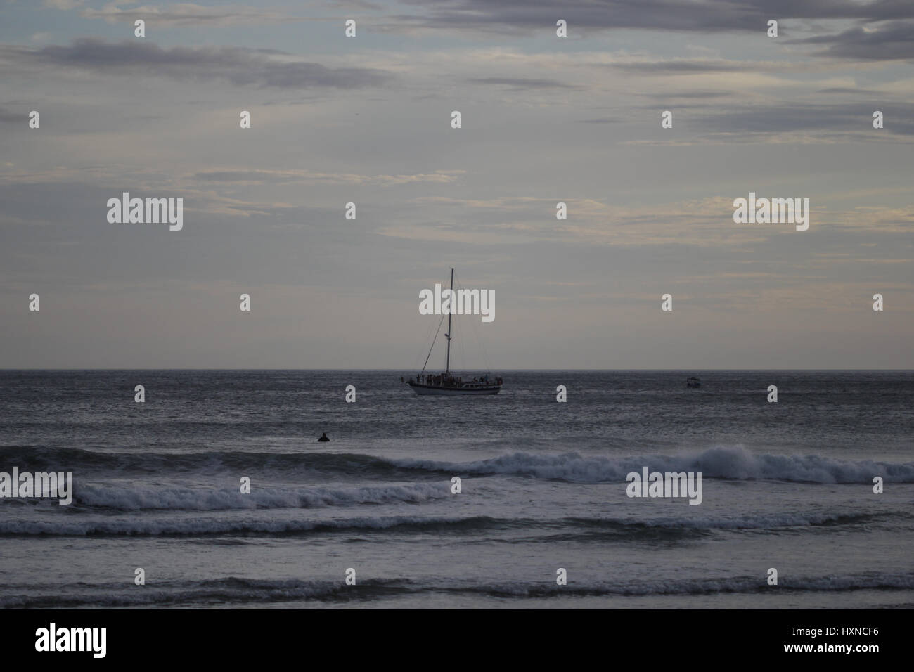 Empty beach at the sunset next to ocean Stock Photo - Alamy