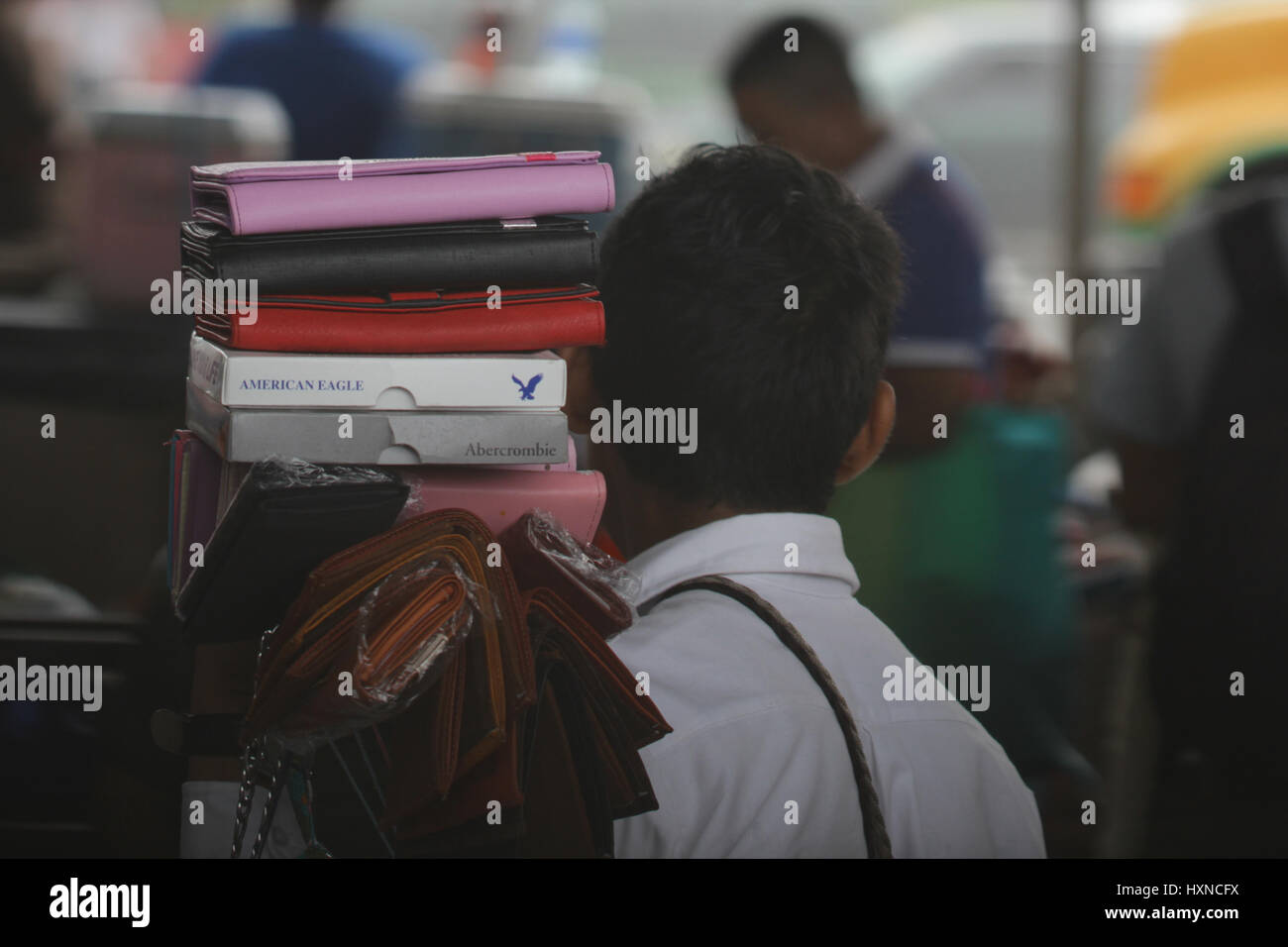 Young men is holding on his shoulder and selling wallets Stock Photo ...