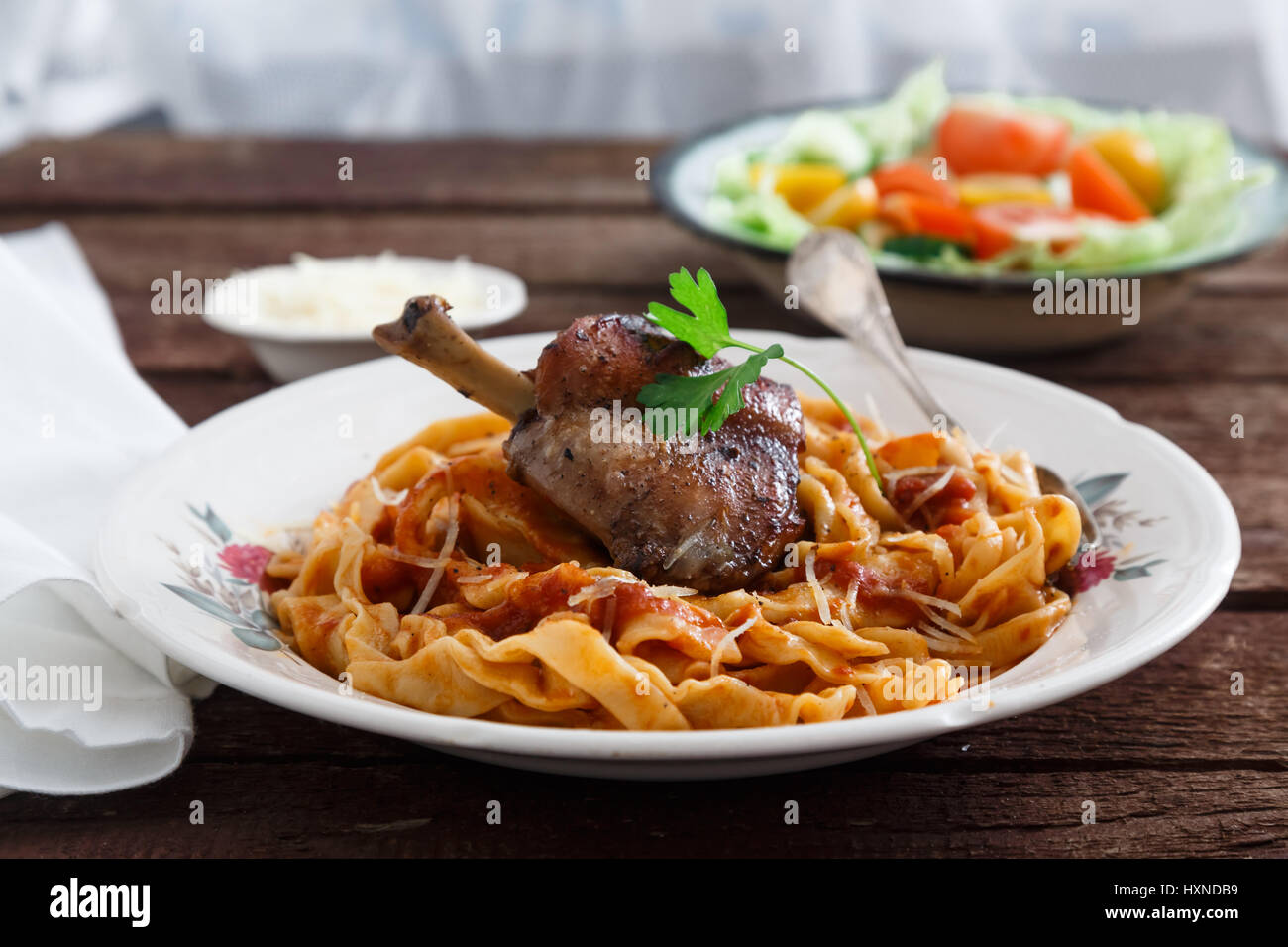Braised Rabbit Leg in Tomato Sauce with Homemade pasta, dark rustic ...