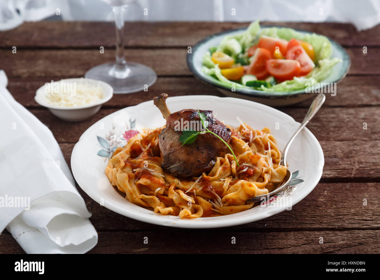 Braised Rabbit Leg in Tomato Sauce with Homemade pasta, dark rustic ...
