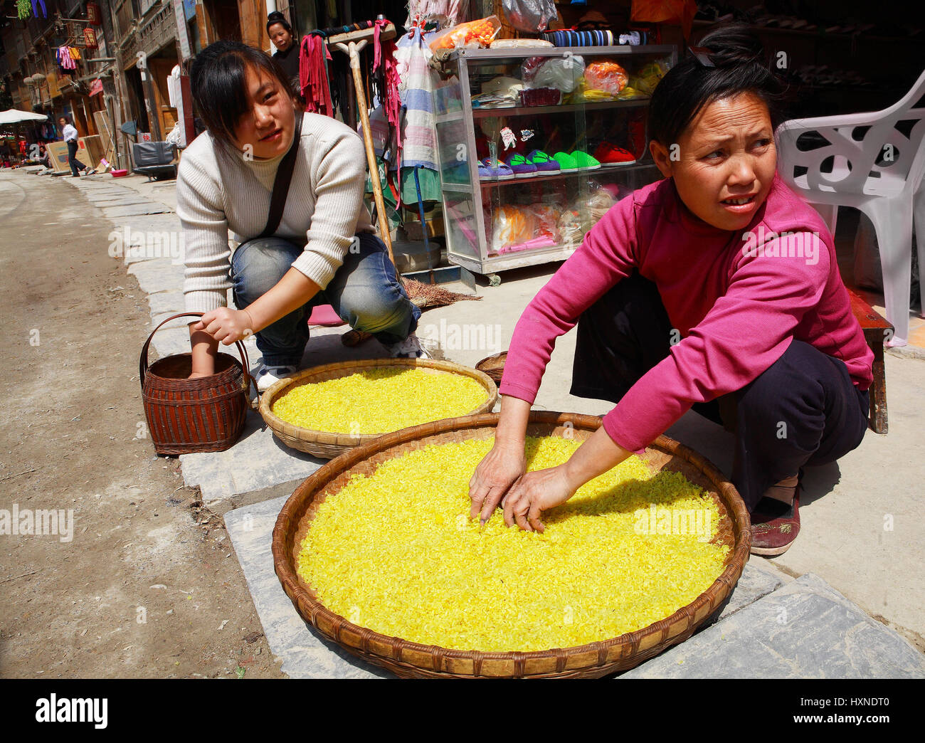 GUIZHOU PROVINCE, CHINA - APRIL 8: Dong ethnic women treated with rice ...