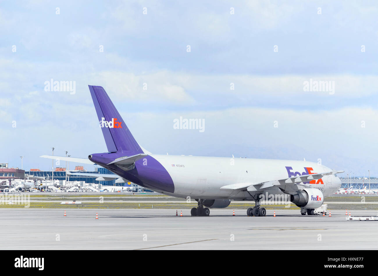 Plane Airbus A300, of FedEx airline, is parked outside of runway, in ...