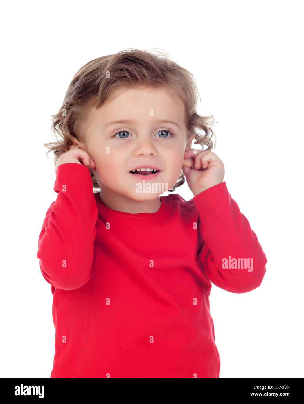 Beautiful little child two years old touching his ears isolated on a ...