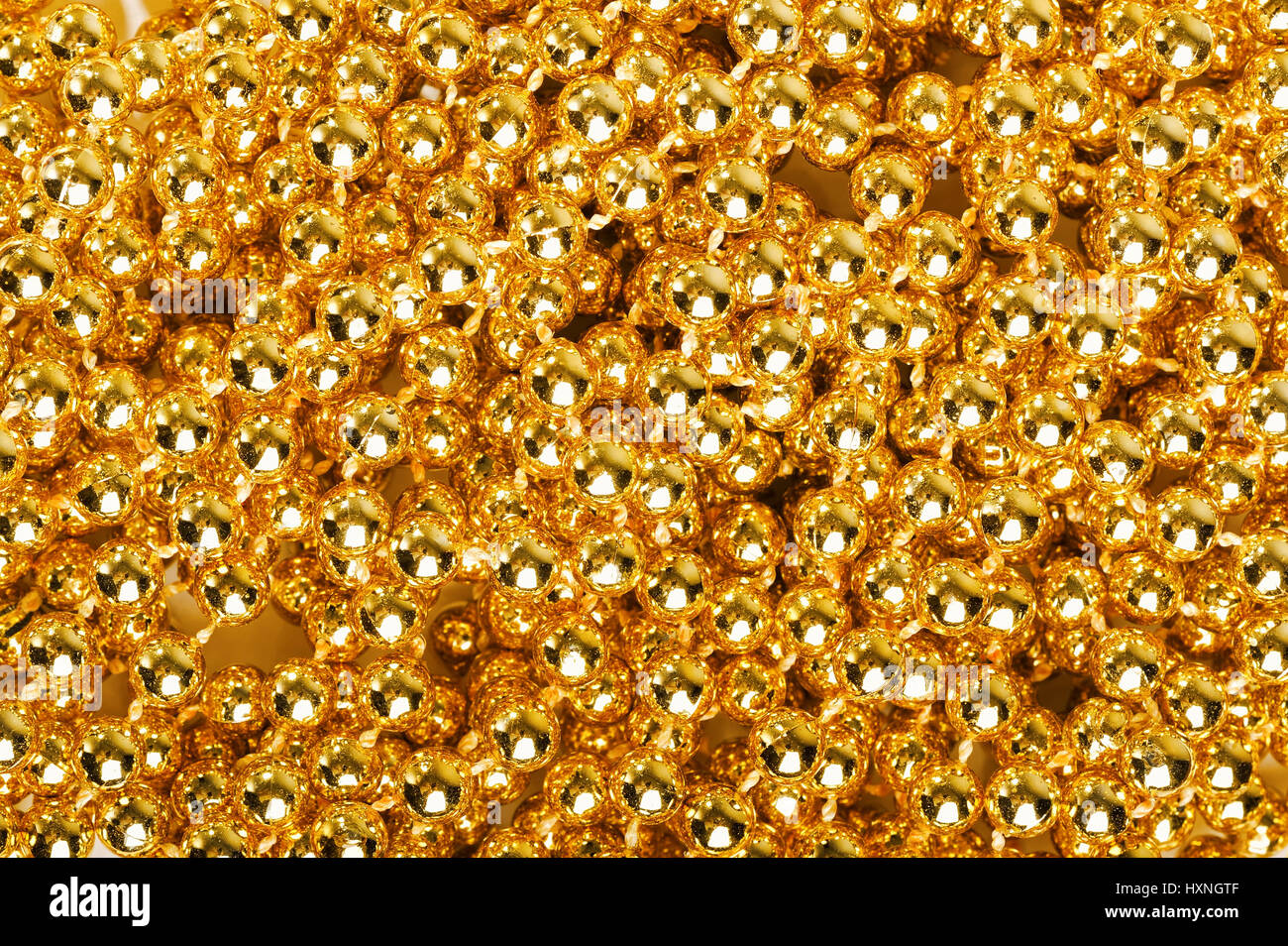 Many little golden balls Stock Photo - Alamy