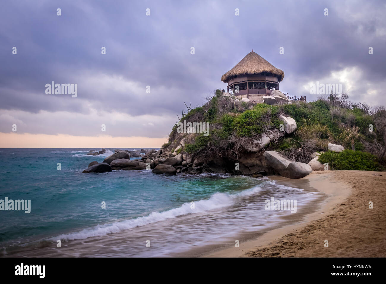 Sunset and beach hut at Cabo San Juan - Tayrona Natural National Park ...