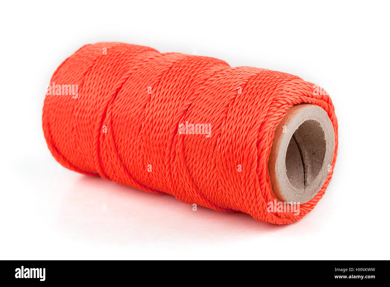 Spool of orange utility rope isolated on white Stock Photo - Alamy