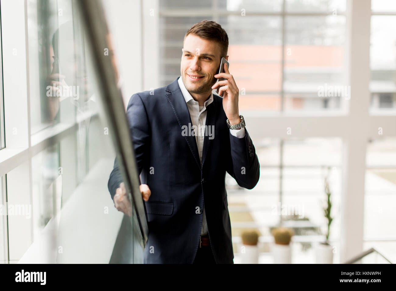 Businessman having phone call in the office Stock Photo - Alamy