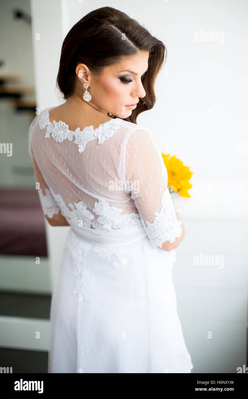 Pregnant bride with a bouquet of sunflowers Stock Photo - Alamy