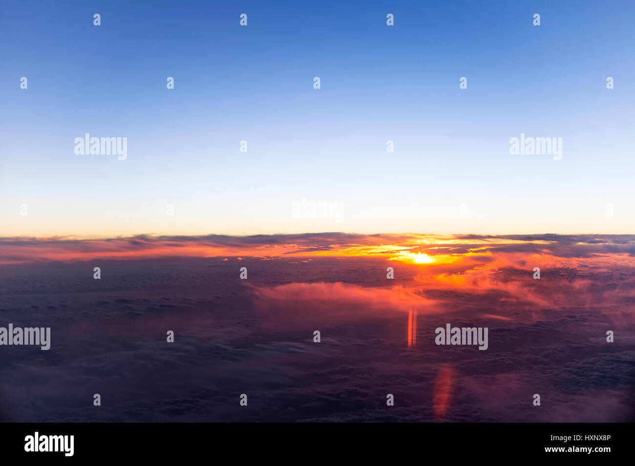Sunset or sunrise from airplane Stock Photo - Alamy