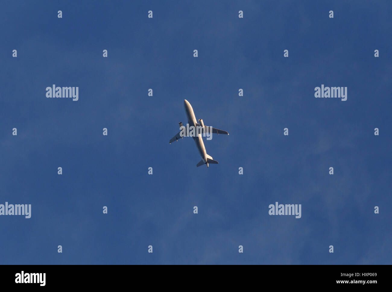 aircraft in a blue sky Stock Photo - Alamy