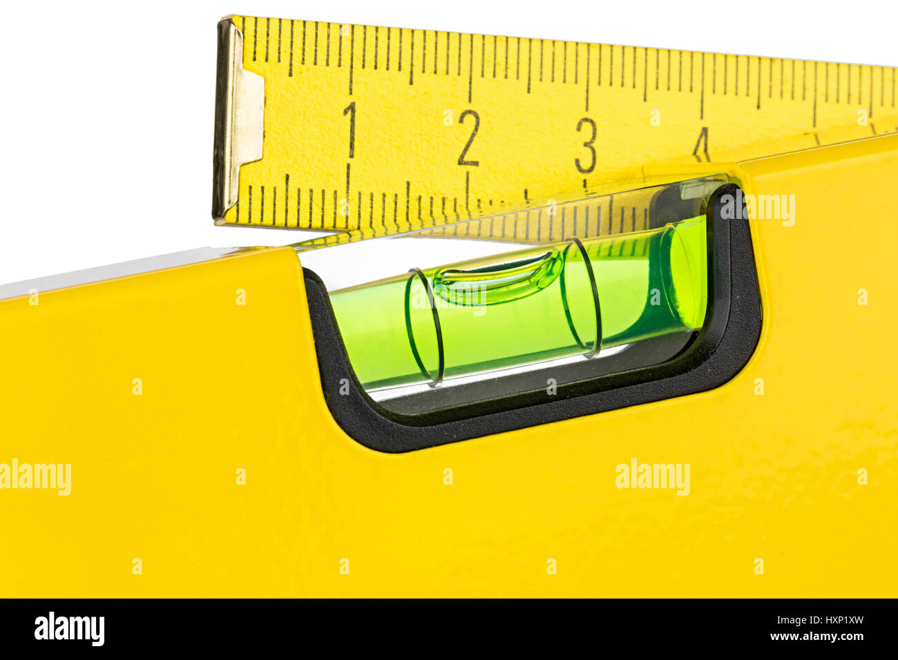 yellow spirit level and folding rule isolated on white background Stock ...
