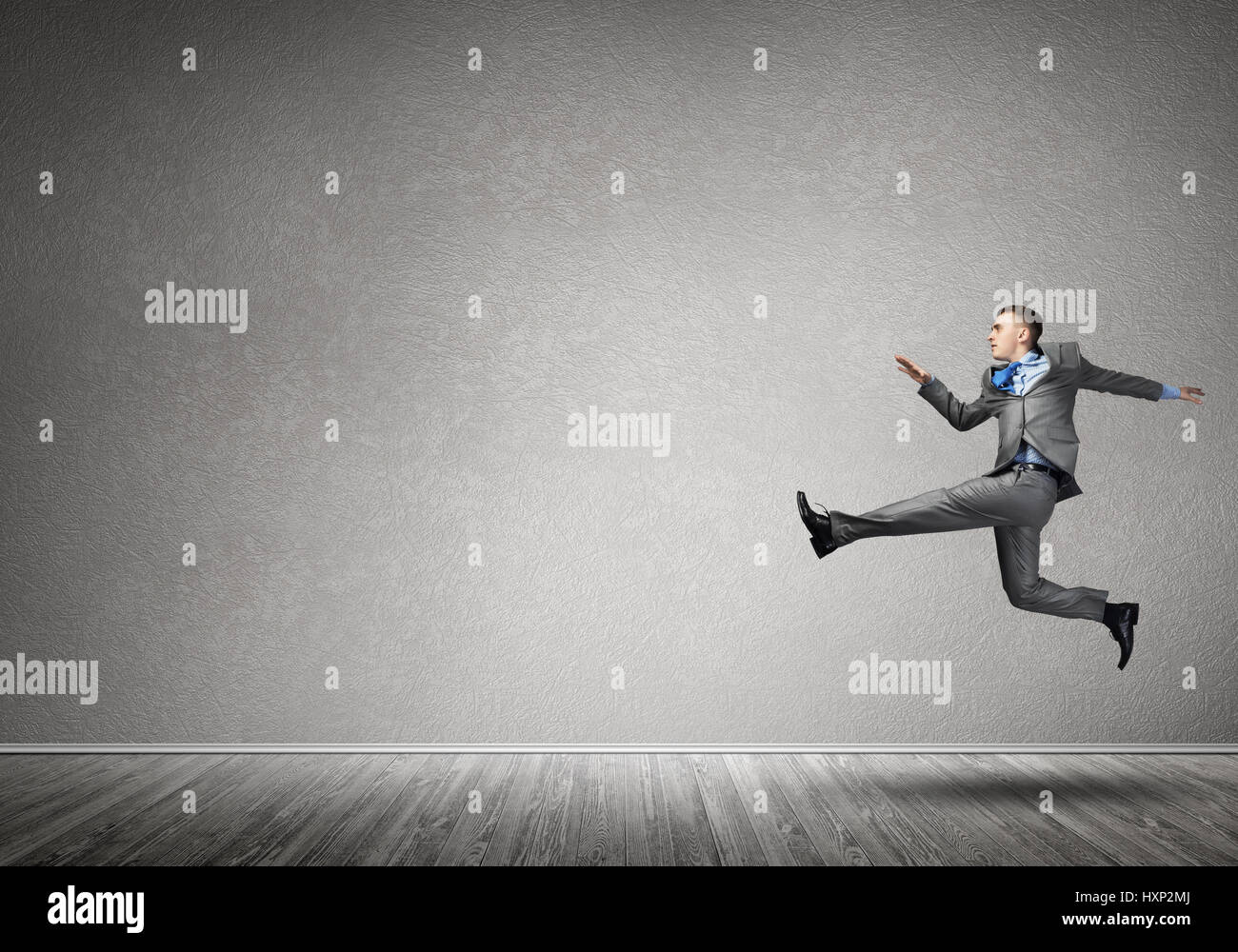 Businessman jumping high Stock Photo - Alamy