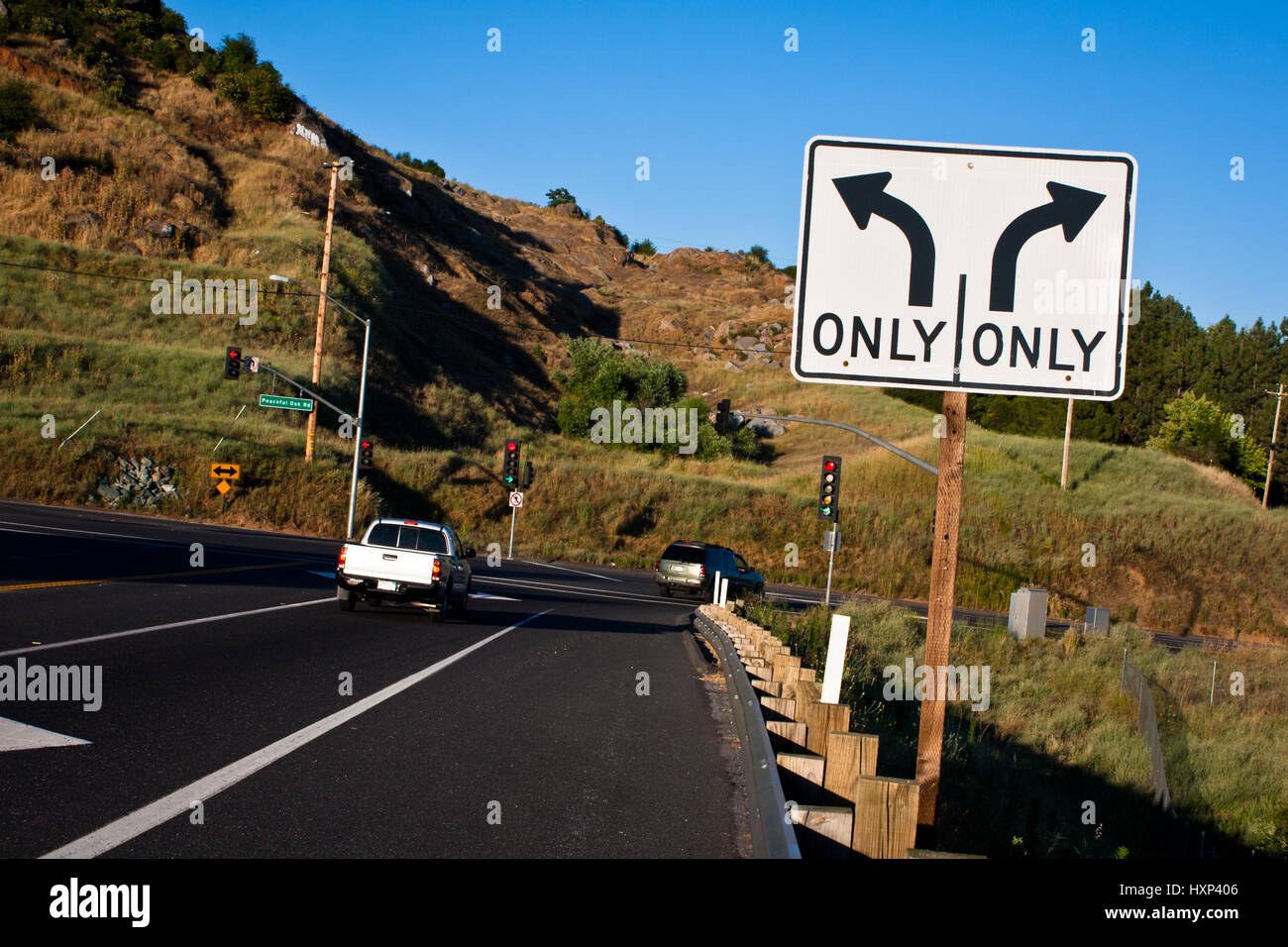 Road sign saying turn only or only with arrows hi-res stock photography ...