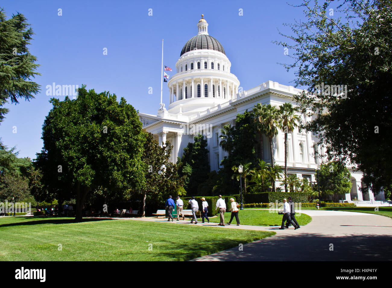 Wide landscape view of Sacramento State Capitol building with dome and ...