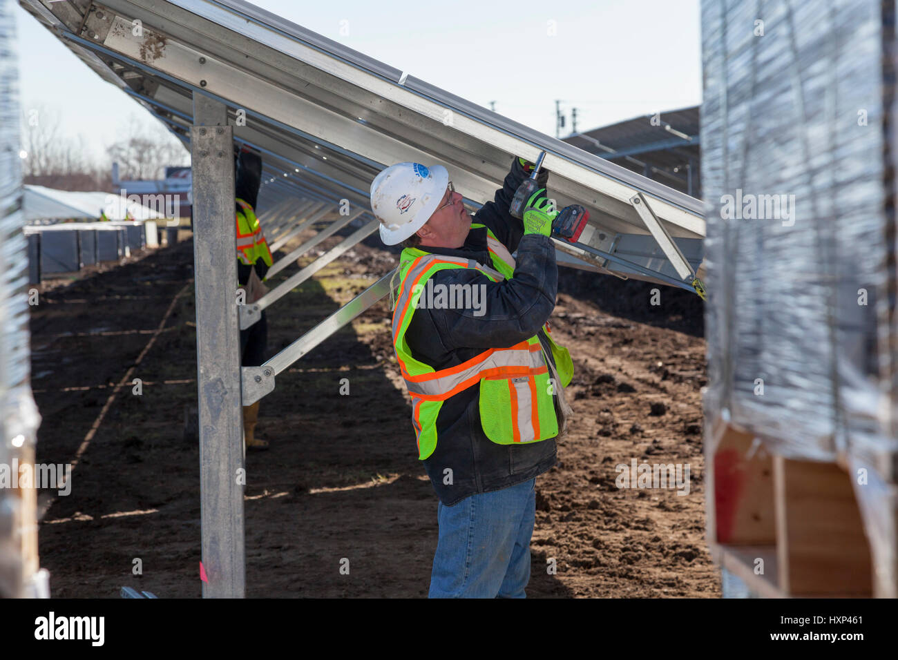 Detroit, Michigan - Workers build a 2 megawatt solar installation for ...