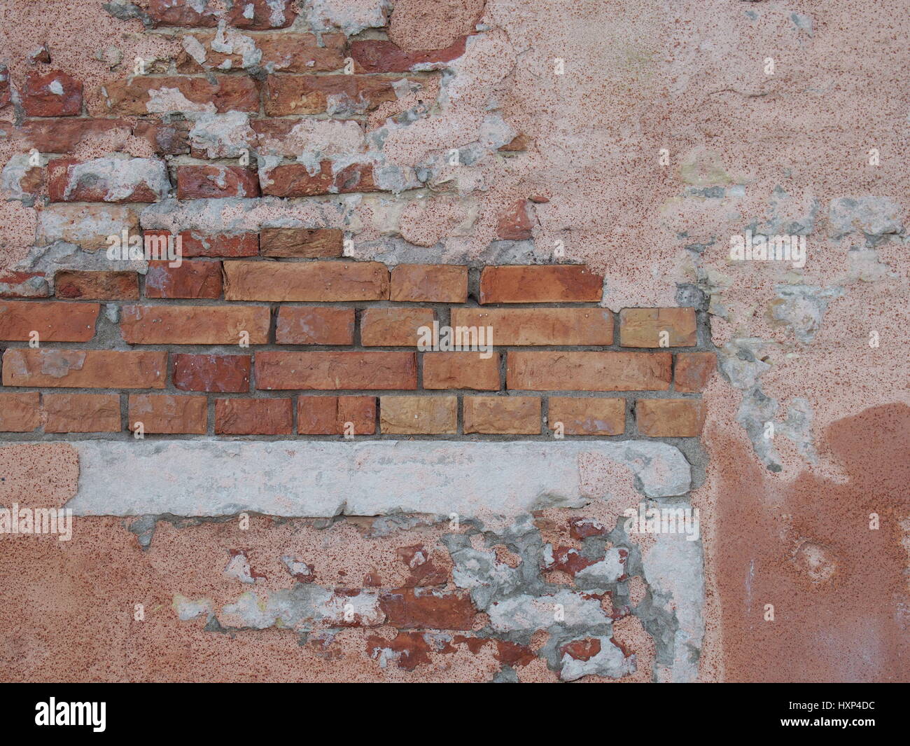 Old red brick wall in italy with many repairs, cement and plaster and ...