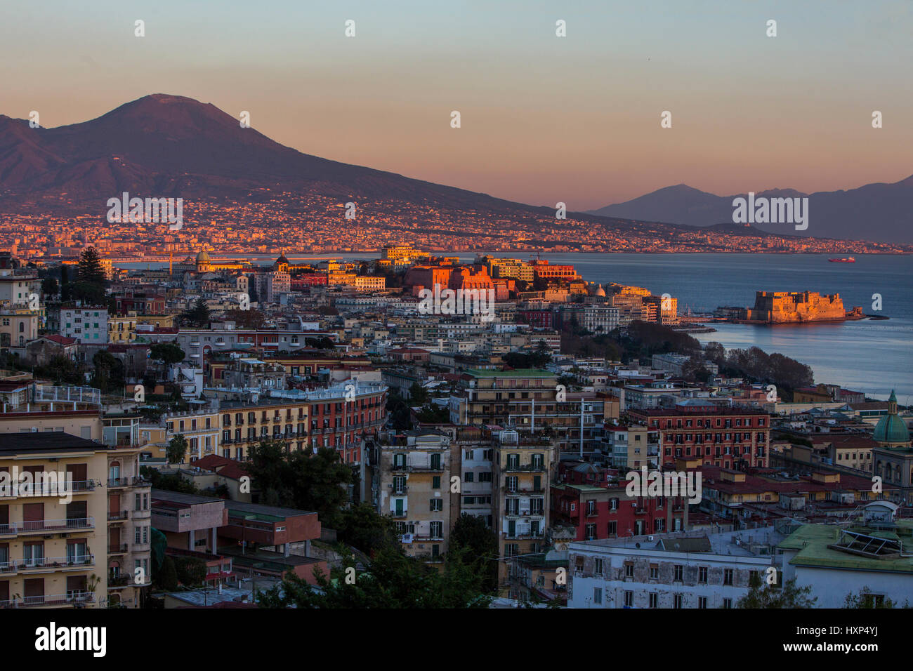 Aerial view of Naples with castle and Vesuvius mount at the sunset ...