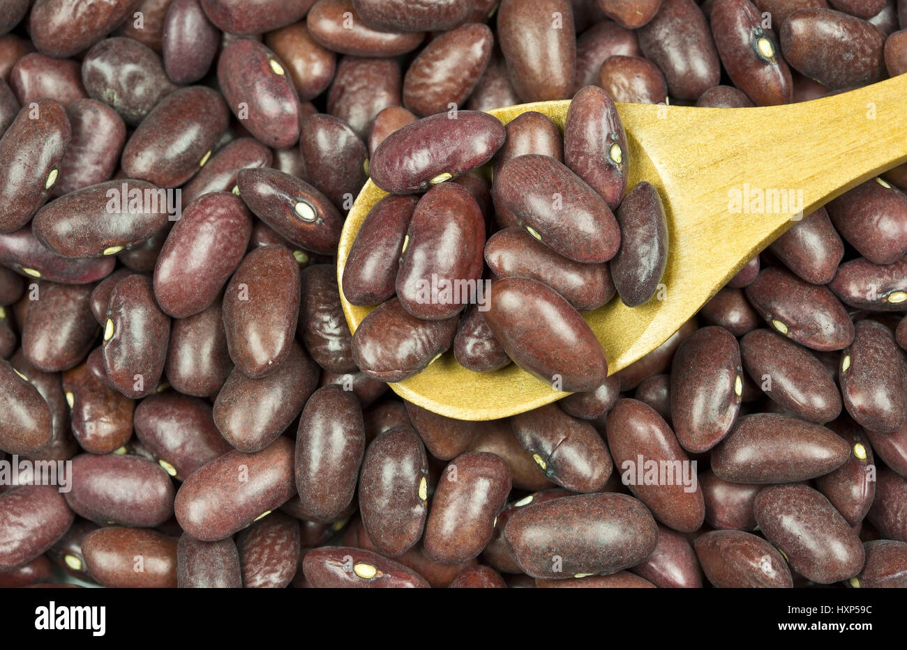 Red beans and wooden spoon for background Stock Photo - Alamy
