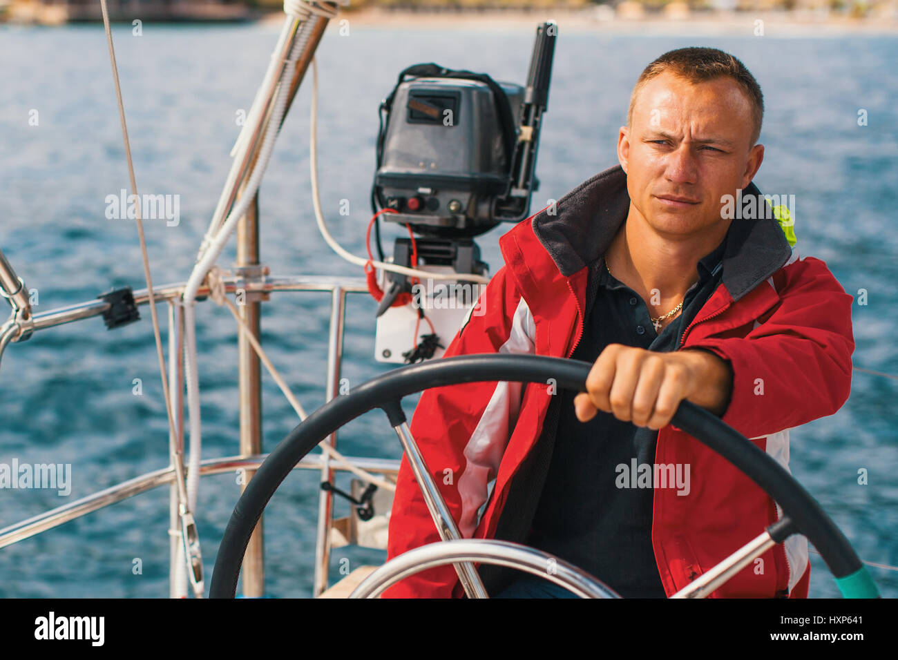 Man wheel boat helm in hi-res stock photography and images - Alamy