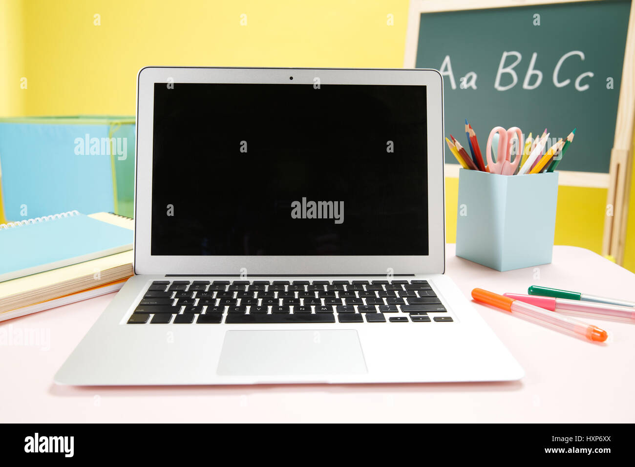 Laptop and blackboard Stock Photo - Alamy