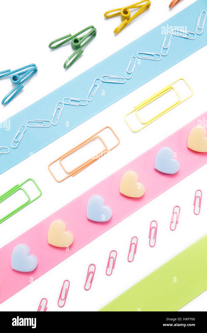 Coloured strips of paper with clips Stock Photo - Alamy