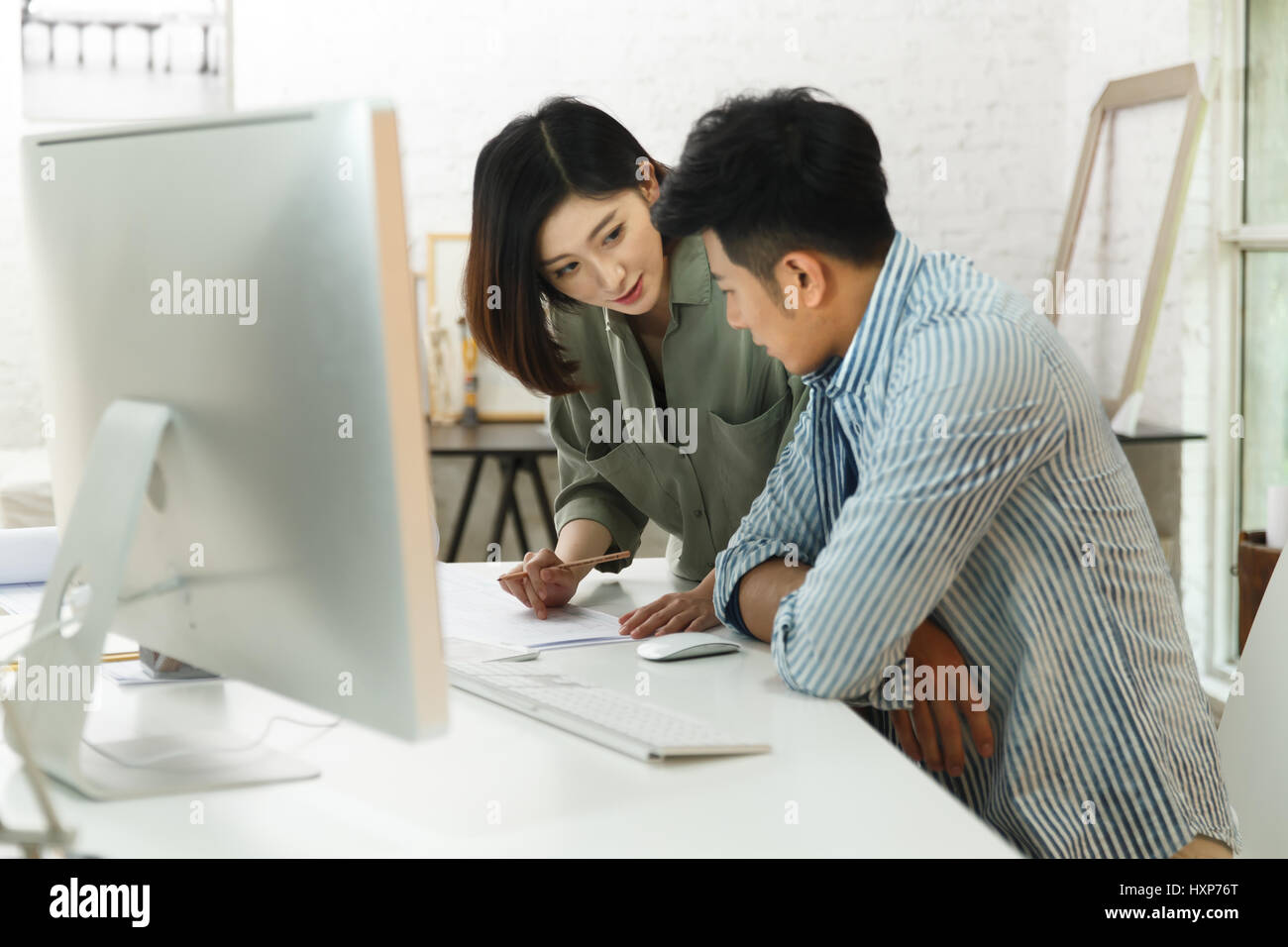 Young couple working at home studio Stock Photo - Alamy