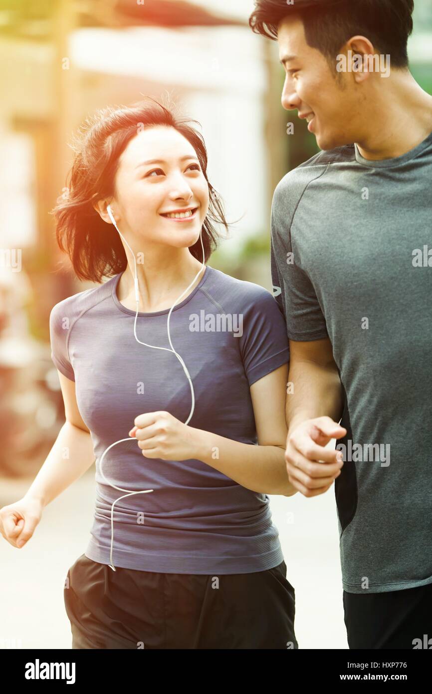 Young couple jogging Stock Photo - Alamy