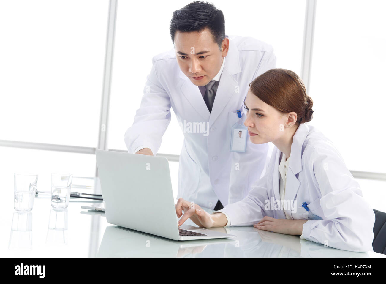 Two doctors working in office Stock Photo - Alamy