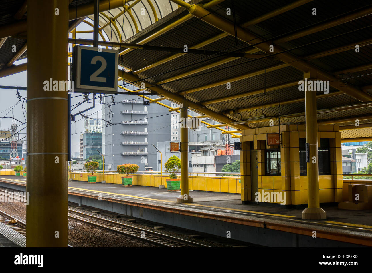 Platform number 2 with blue sign board in train station with city view ...