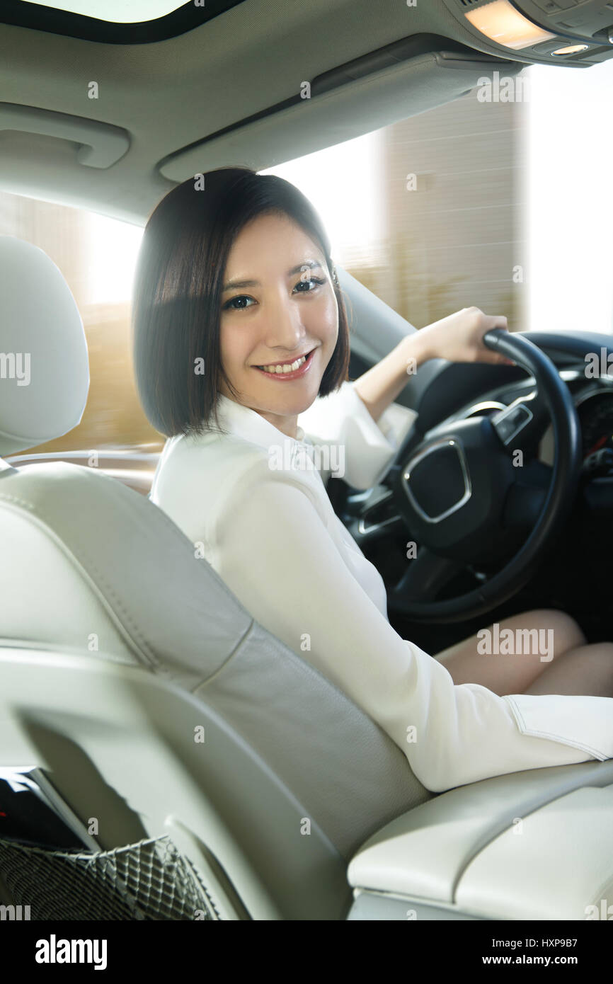 Young woman on driving Stock Photo - Alamy