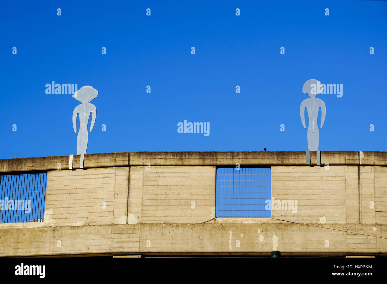 metal statue human figure on a building Stock Photo - Alamy