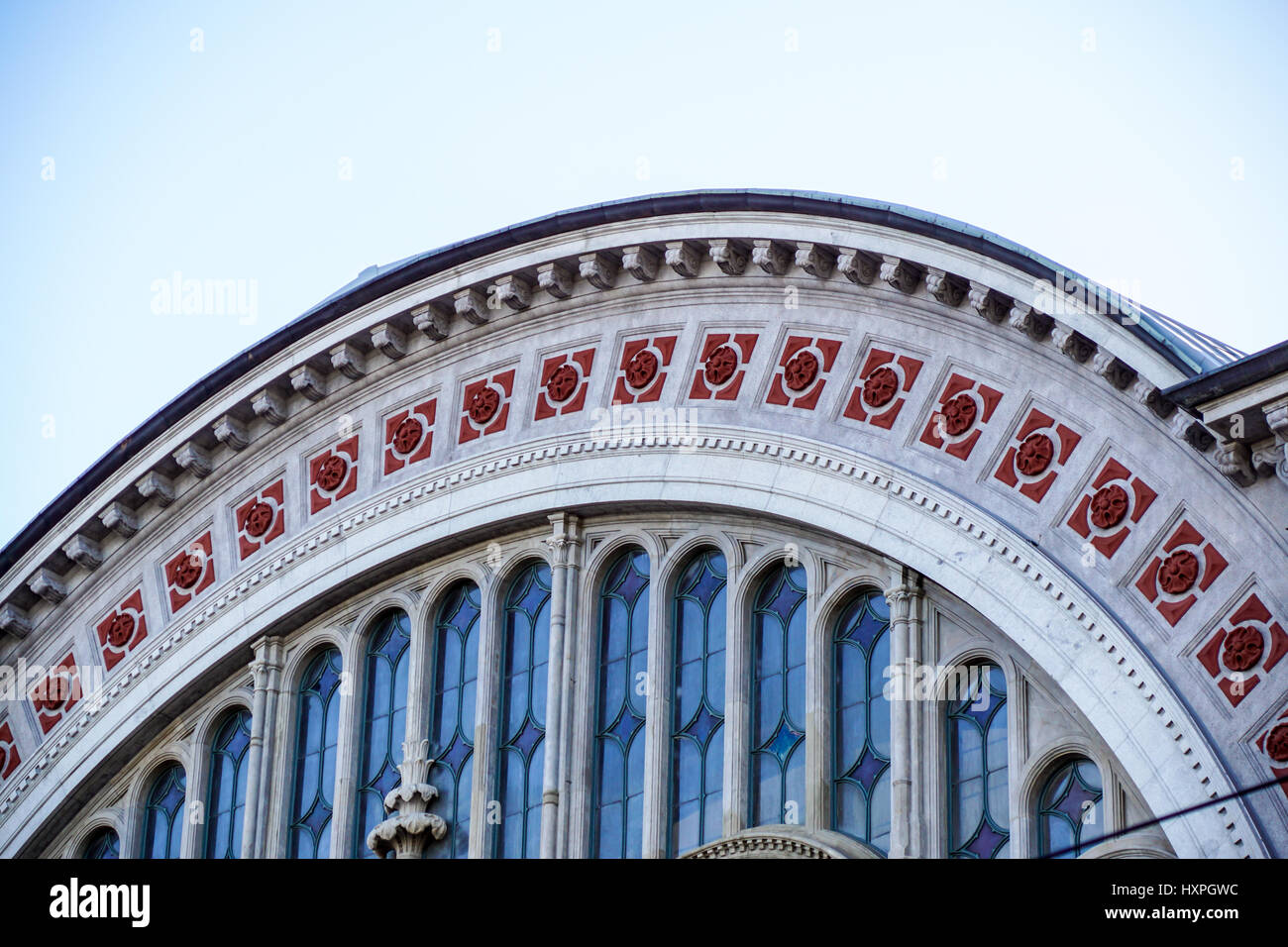 Detail of the facade of semi-circular wall with empty arched windows ...