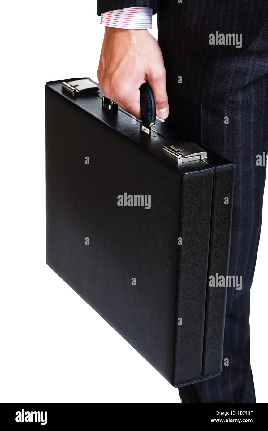 Man in a classic suit holds a black briefcase on an isolated white ...