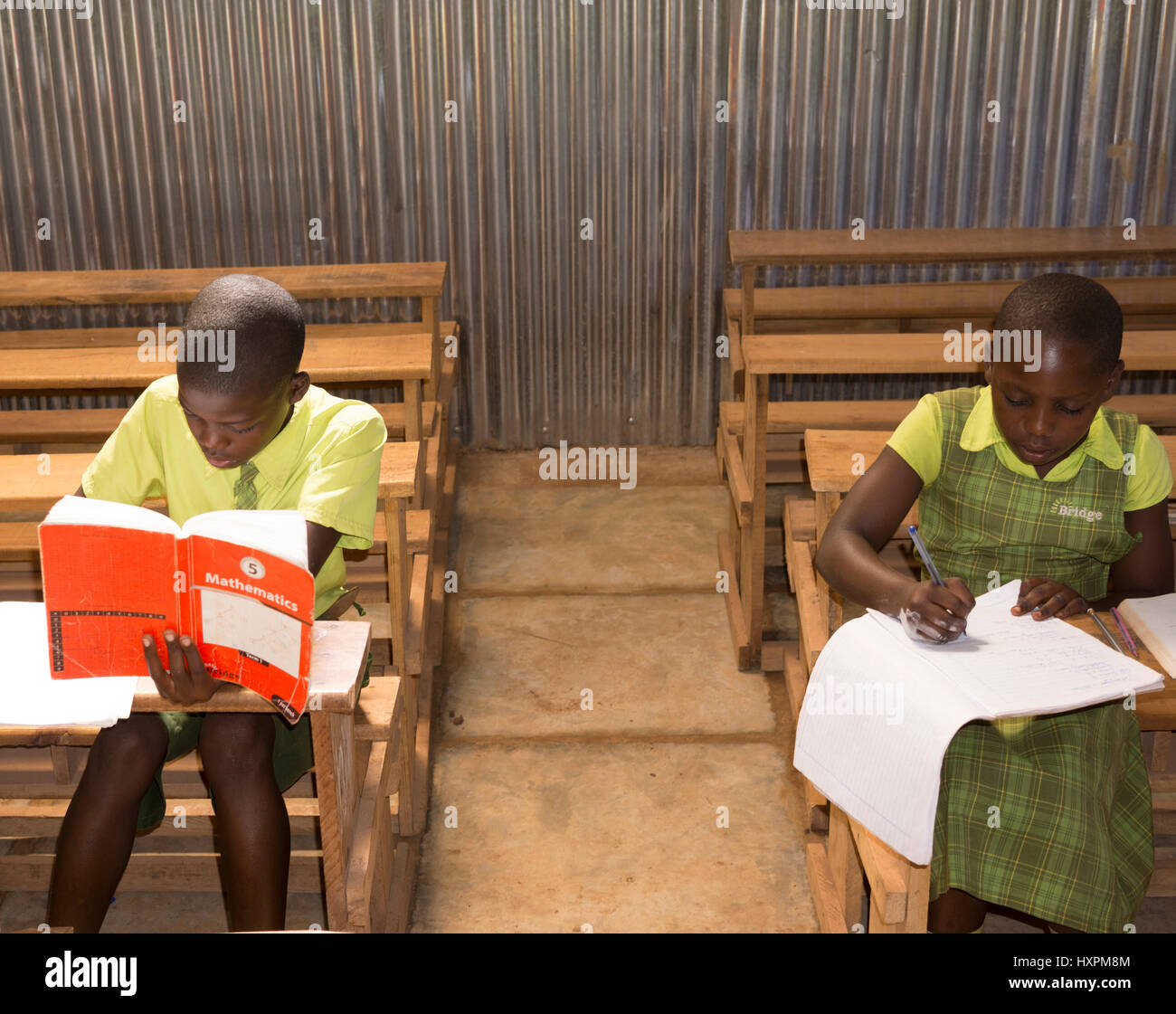 A school girl looks out from her classroom at a Bridge International ...
