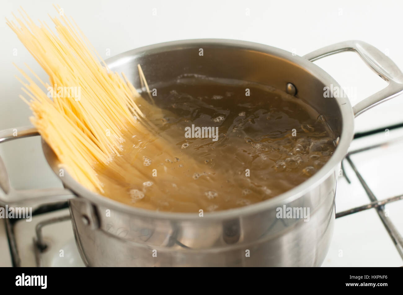 Steel pot on the fire with spaghetti inside boiling in water Stock ...