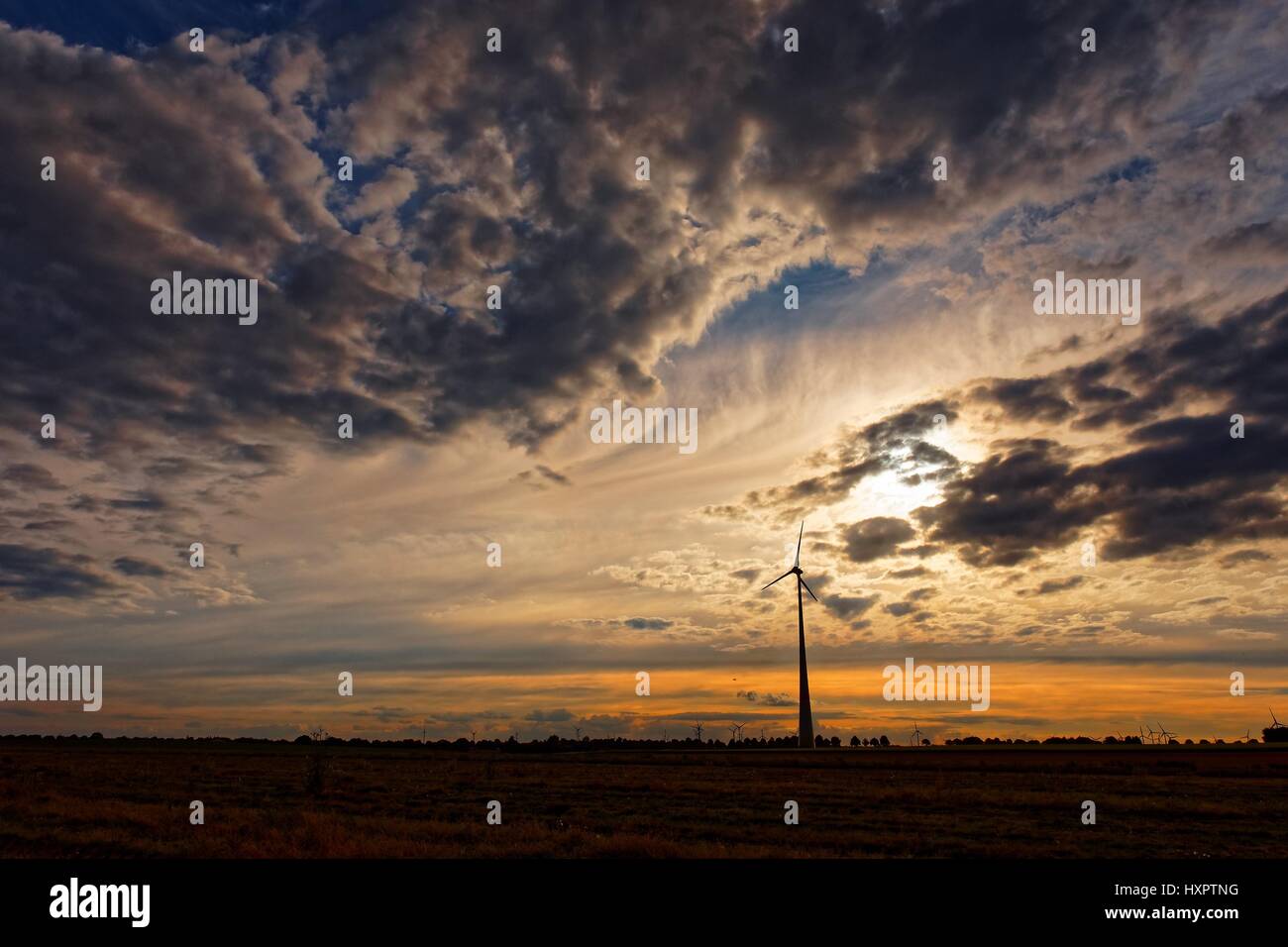 wind energie made through stormy weather at sundown Stock Photo - Alamy