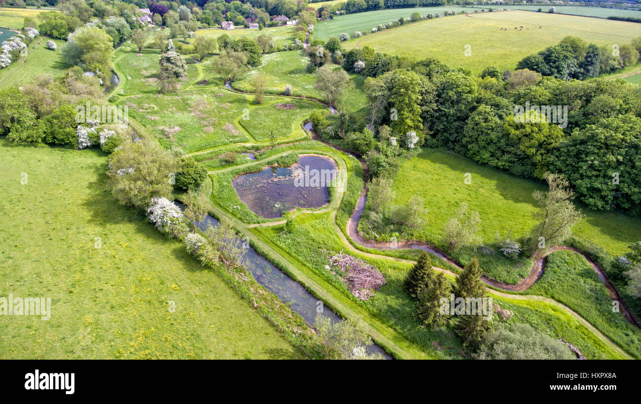 Aerial view of green countryside with fields, farmlands, meadows, small ...